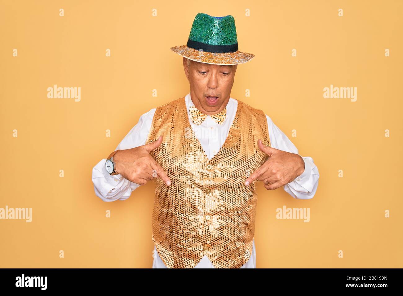 Middle age senior grey-haired man wearing Brazilian carnival custome ...