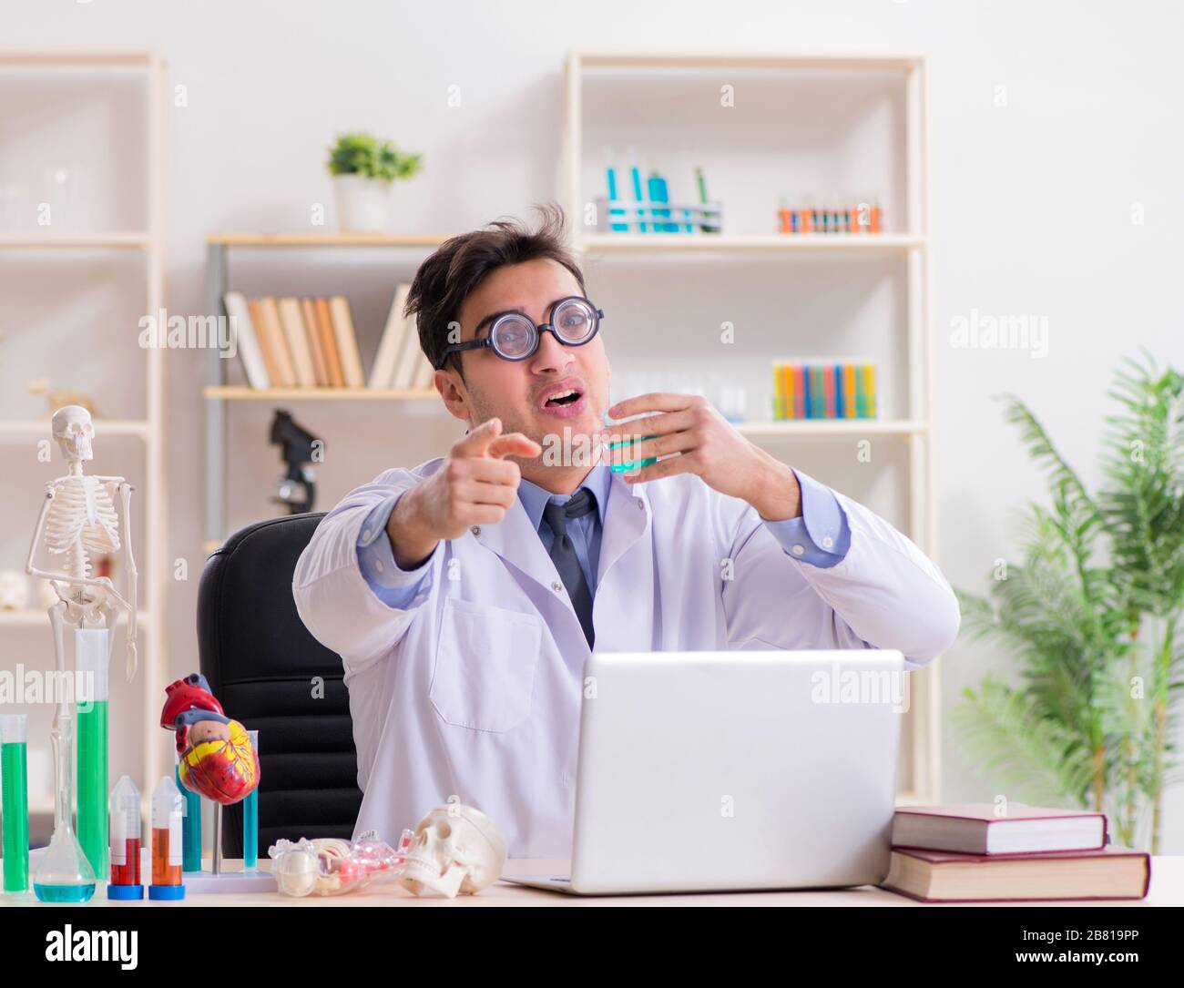 The funny doctor having fun in hospital lab Stock Photo - Alamy