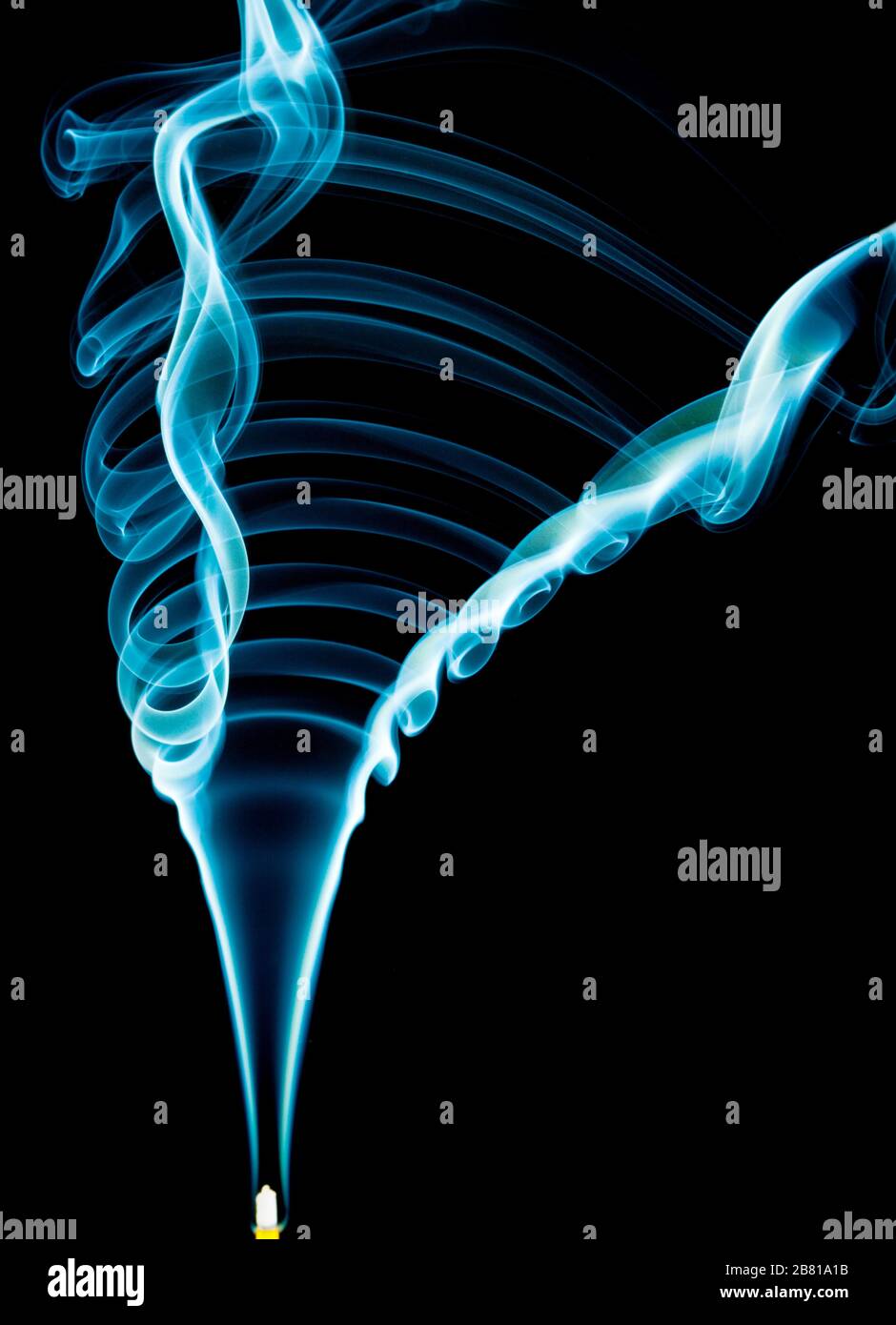 Blue smoke on black background. Smoke and fog spreads and goes from ...