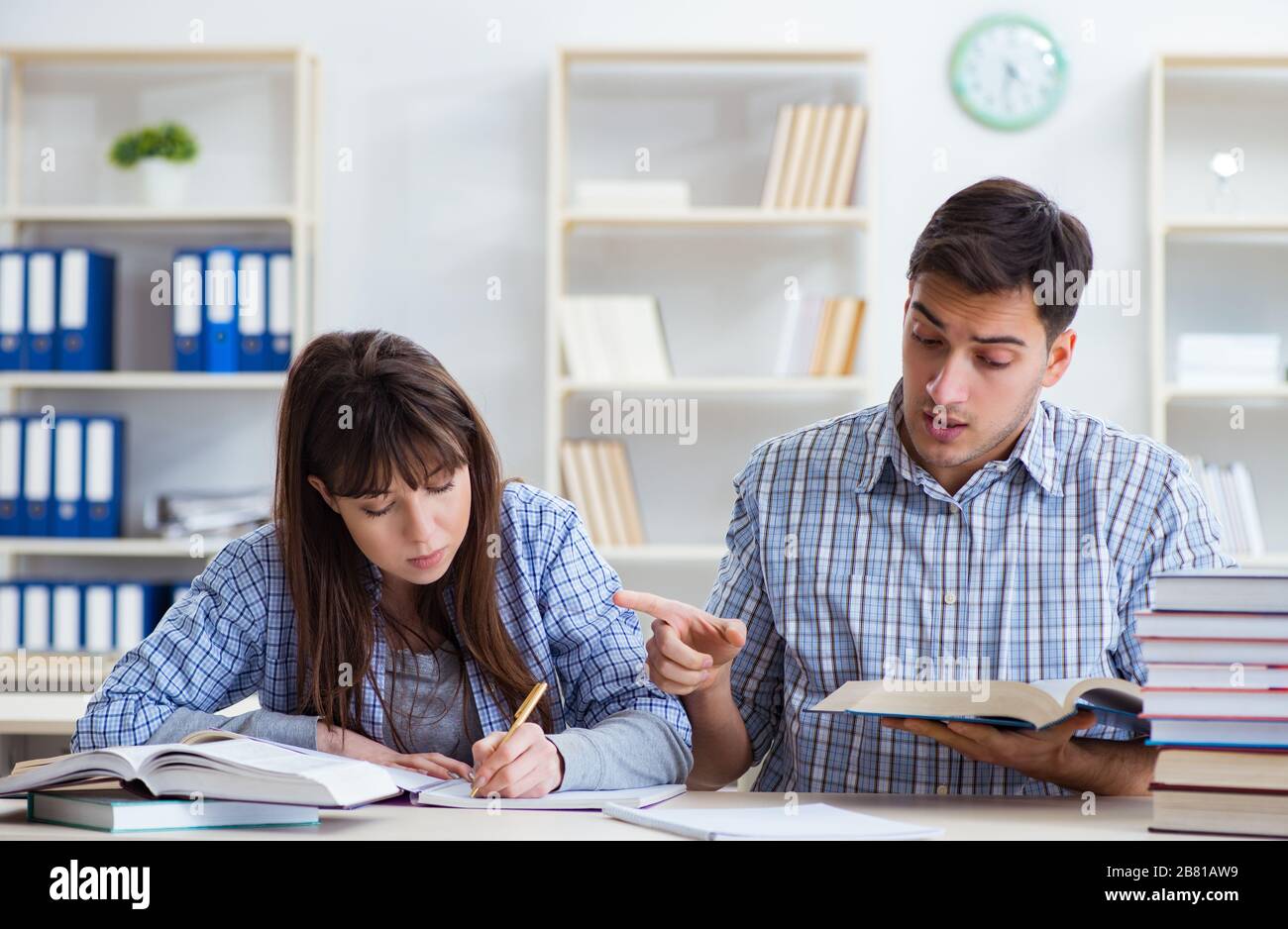 The students sitting and studying in classroom college Stock Photo - Alamy
