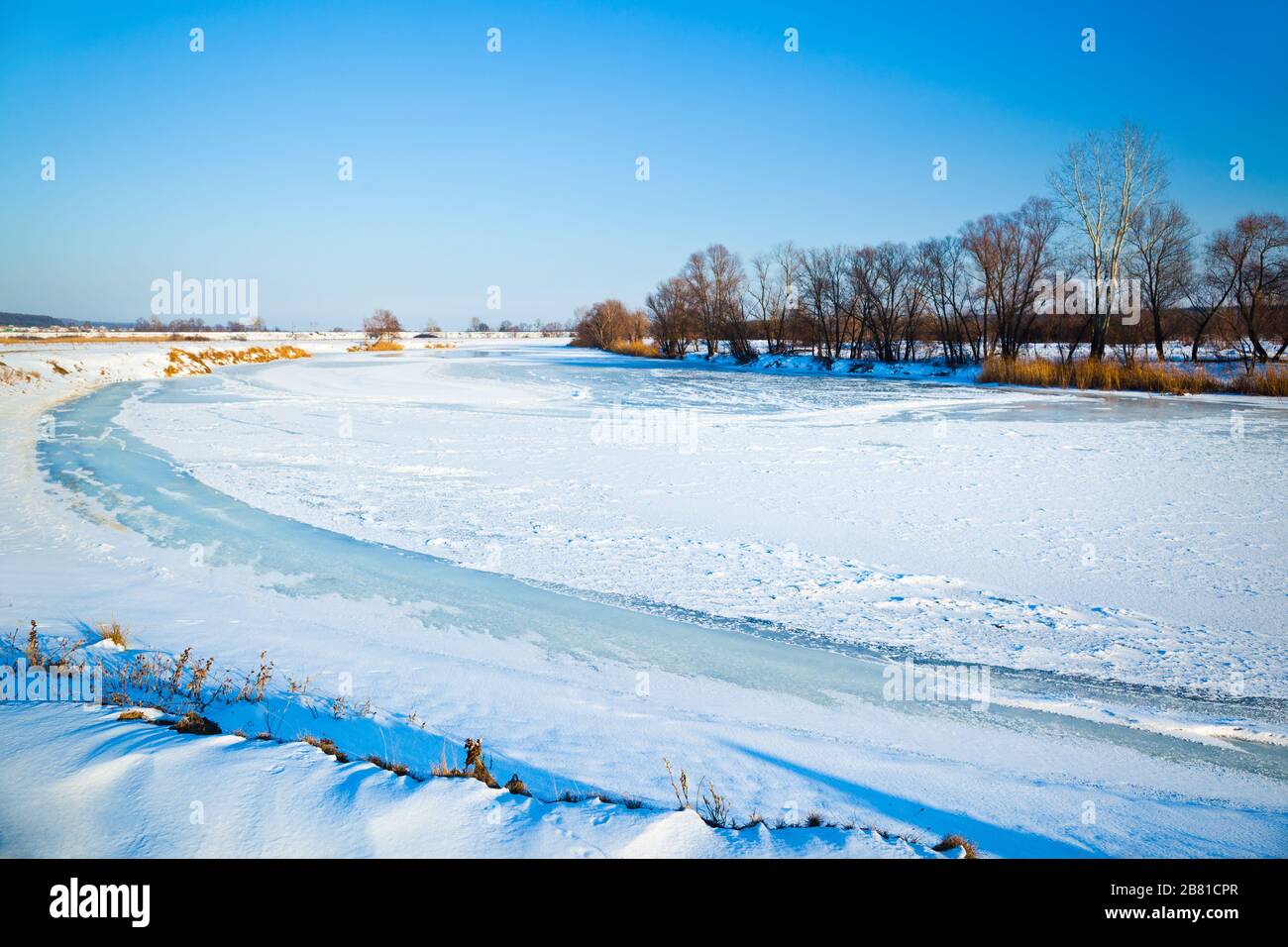 Winter landscape, frozen lake covered with ice and snow, on background ...