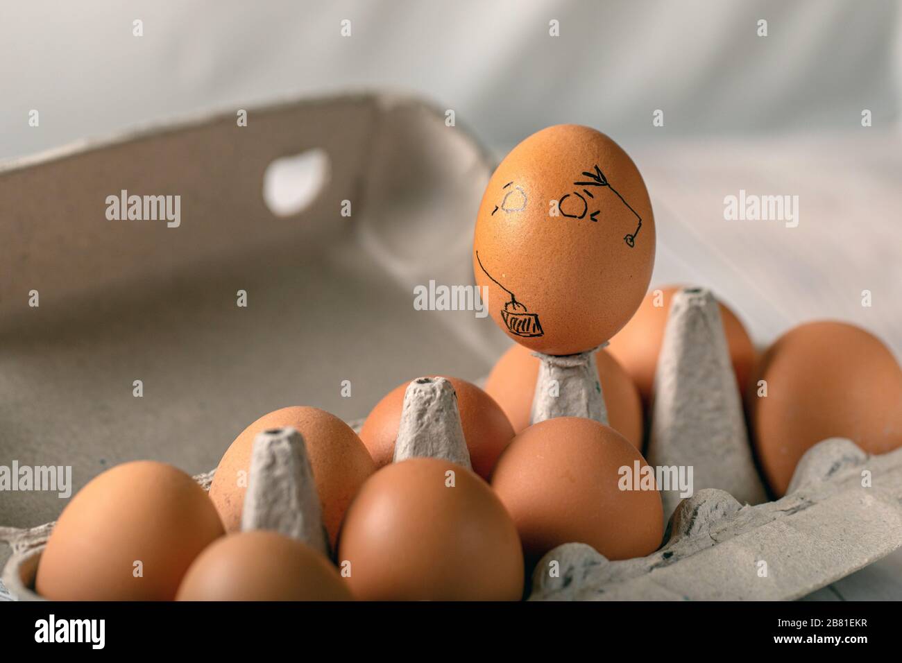 One pained egg standing apart from others eggs. concept of racism ...