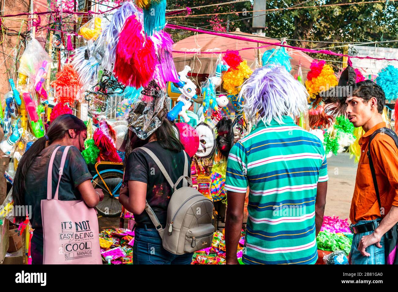 People in City Street Market Stall buying powder dry colors and ...