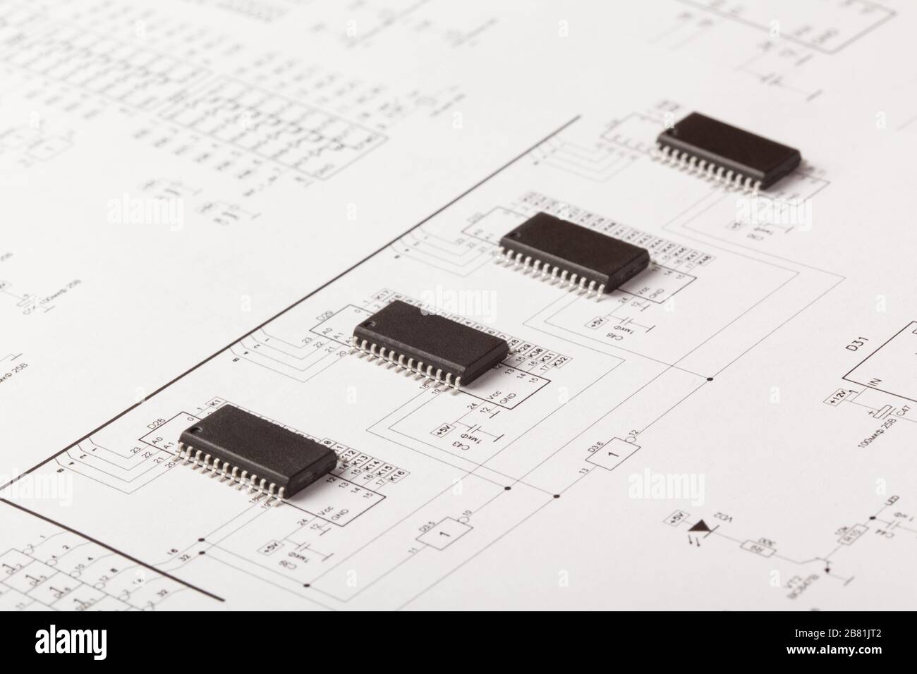 Closeup photo of microcircuit chips on drawing of an electronic device ...