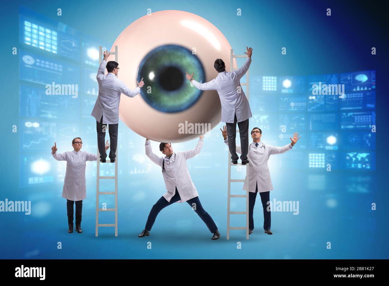 The doctor examining giant eye in medical concept Stock Photo - Alamy