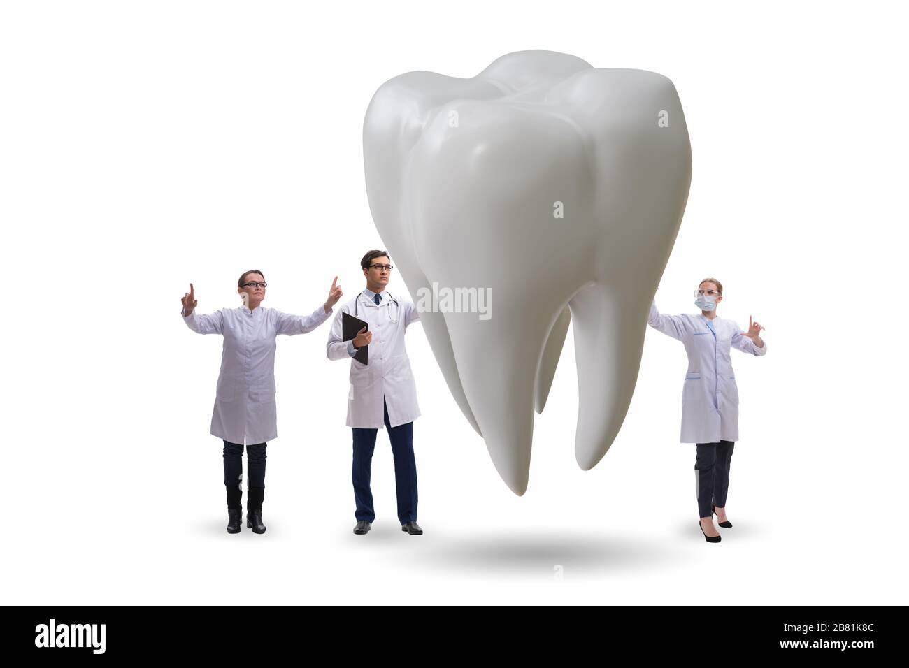 The doctors examining giant tooth in dental concept Stock Photo - Alamy