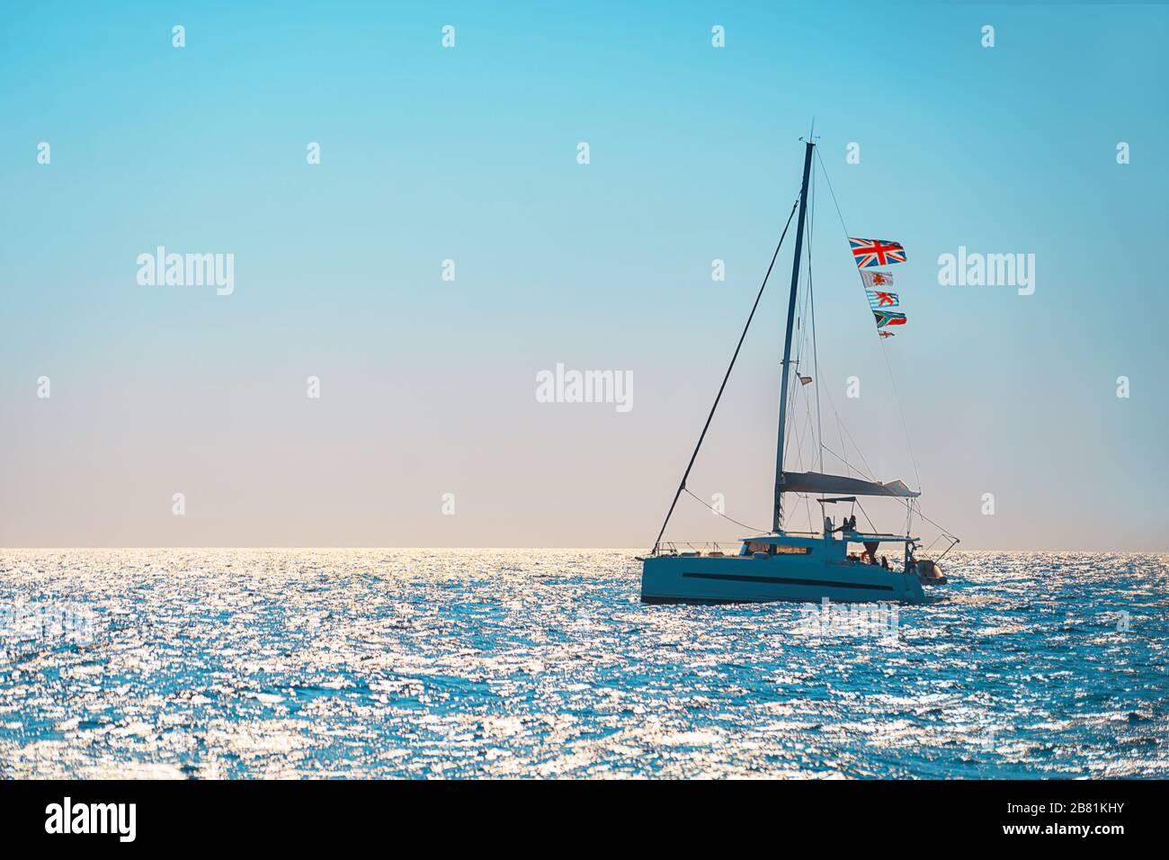 Sailboat boat in the open blue sea in Greece, on sunset time. Yachting ...