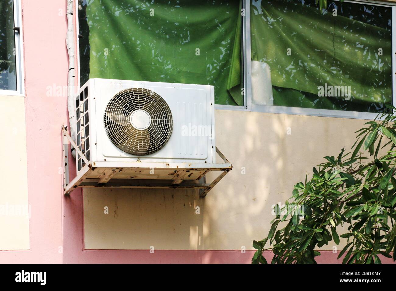 Air conditioner compressor installed outdoors hi-res stock photography ...