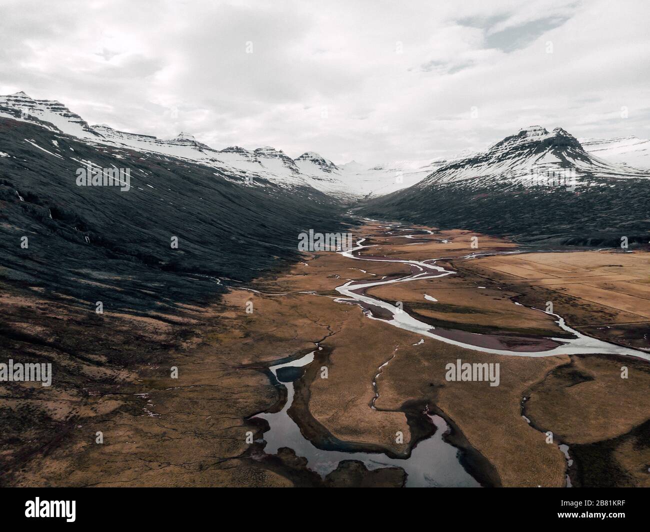 Aerial shot of Icelandic rivers through the Fjords in Autumn with ...