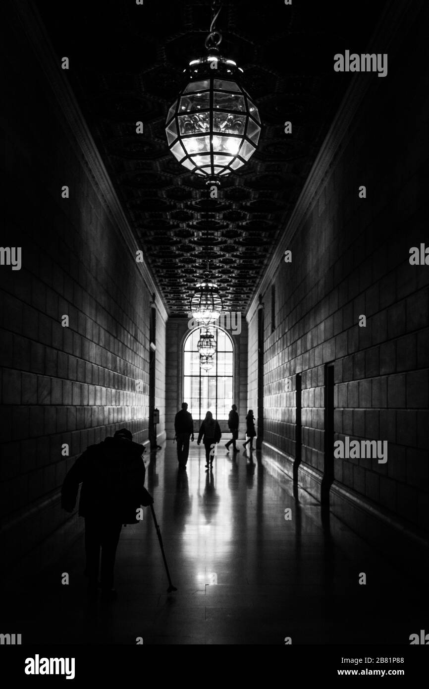 People walking down a hallway inside the New York public Library Stock ...