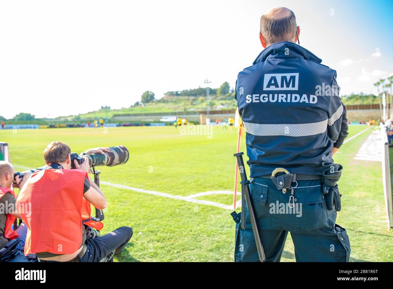 security guard on a football match. title on his back in Spanish ...