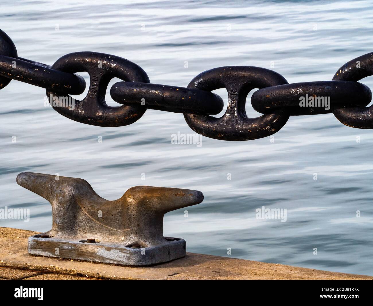 water with black chain on dock Stock Photo - Alamy