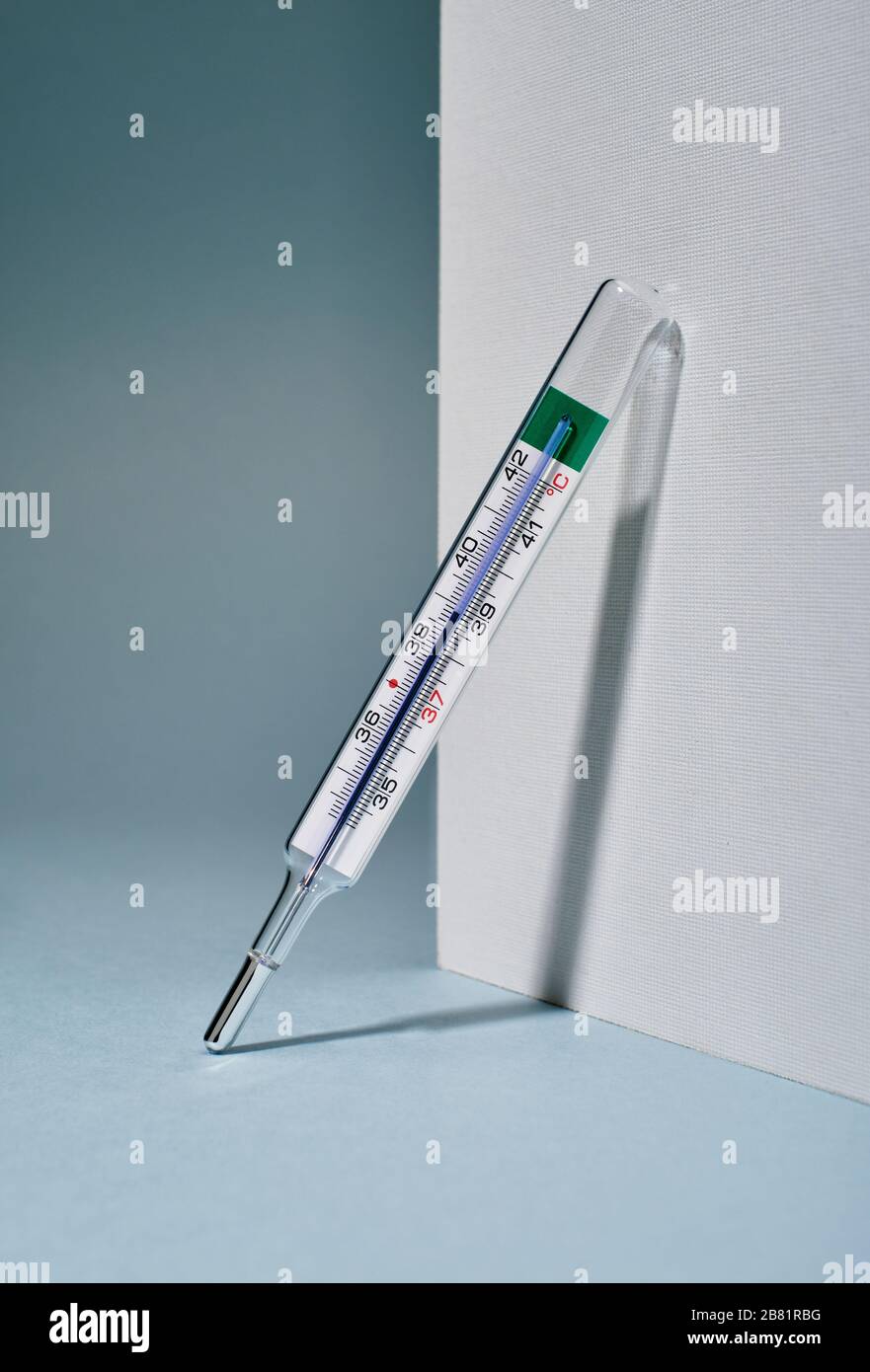 Thermometer with high temperature and shadow on paper background shot ...