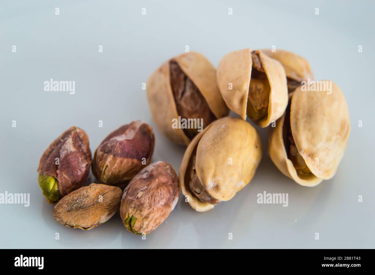 Pistachios with and without shell hi-res stock photography and images ...