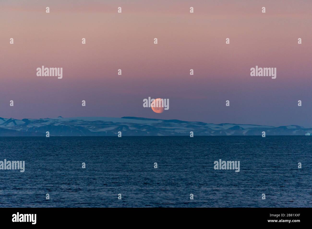 Beautiful moonrise in Greenland. Iceberg at sea Stock Photo - Alamy