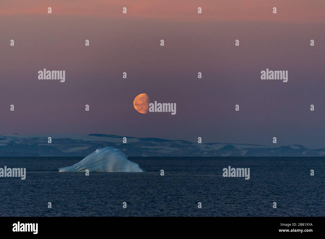 Beautiful moonrise in Greenland. Iceberg at sea Stock Photo - Alamy