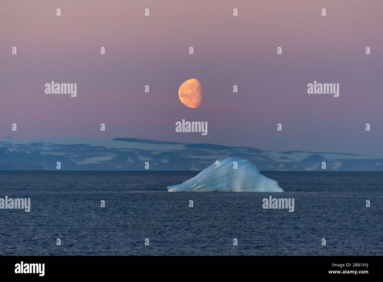 Beautiful moonrise in Greenland. Iceberg at sea Stock Photo - Alamy