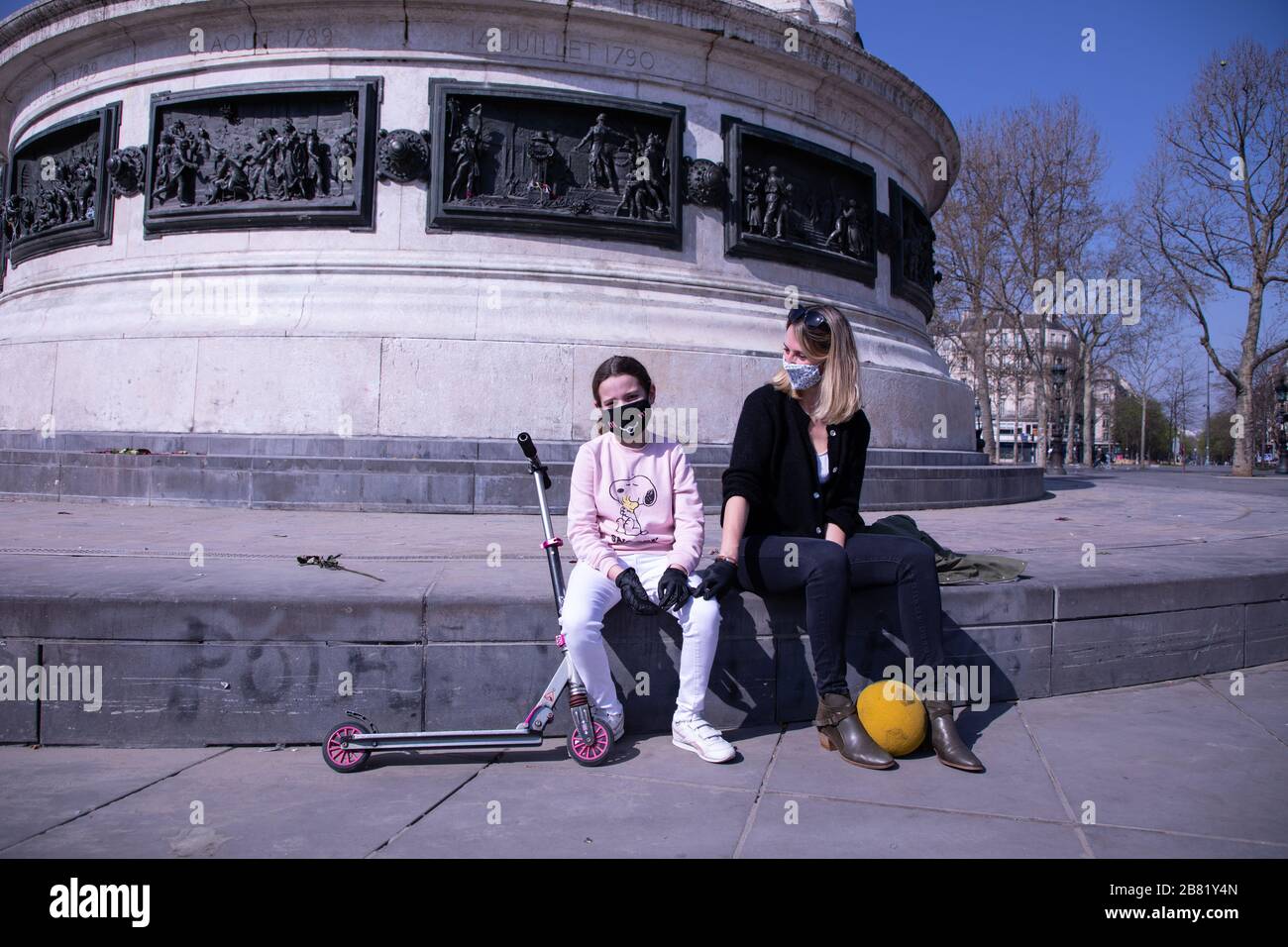 Angelique and her daughter Oceane (10 years old) wear face masks as a ...