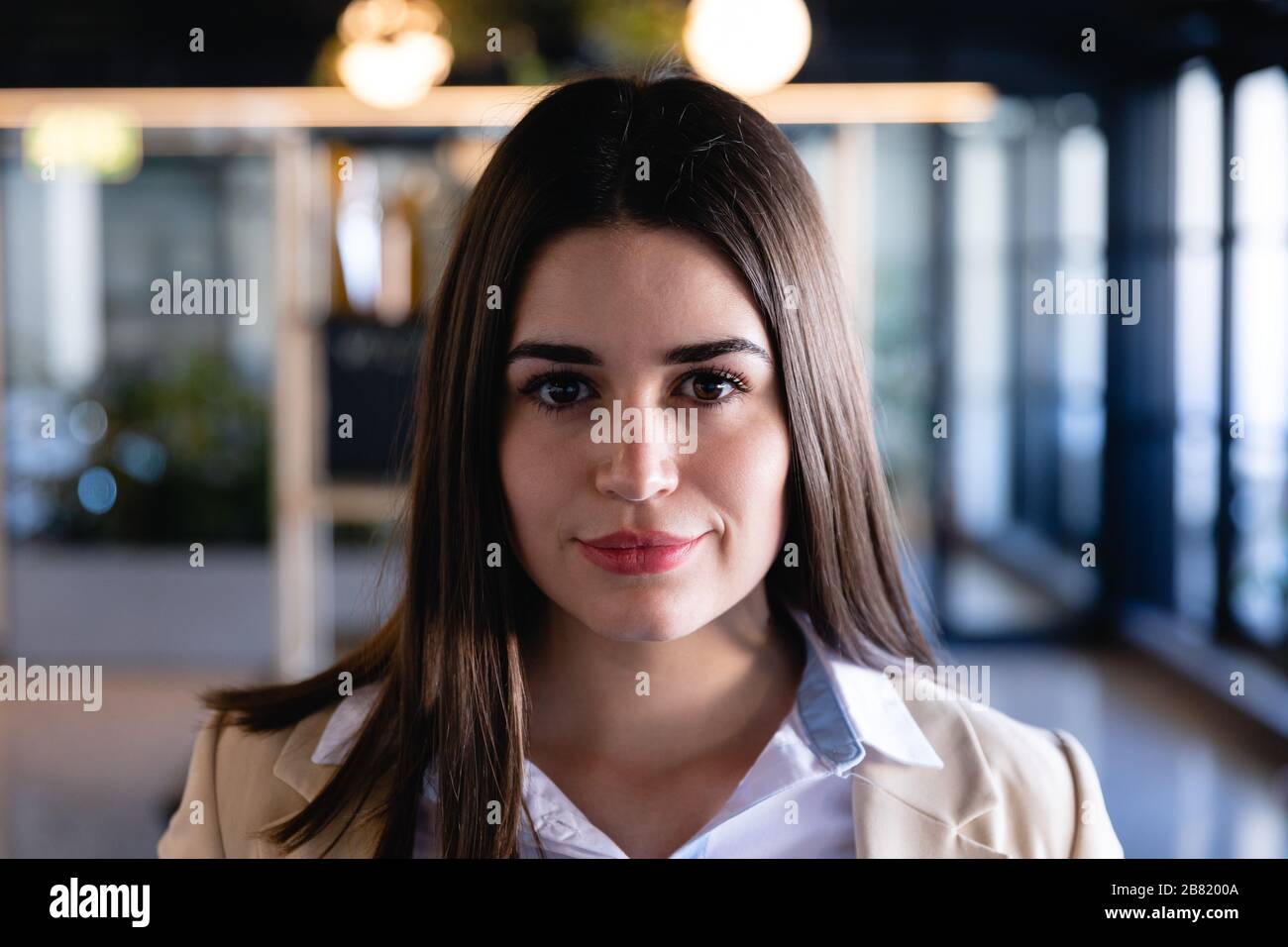 Woman looking down camera hi-res stock photography and images - Alamy