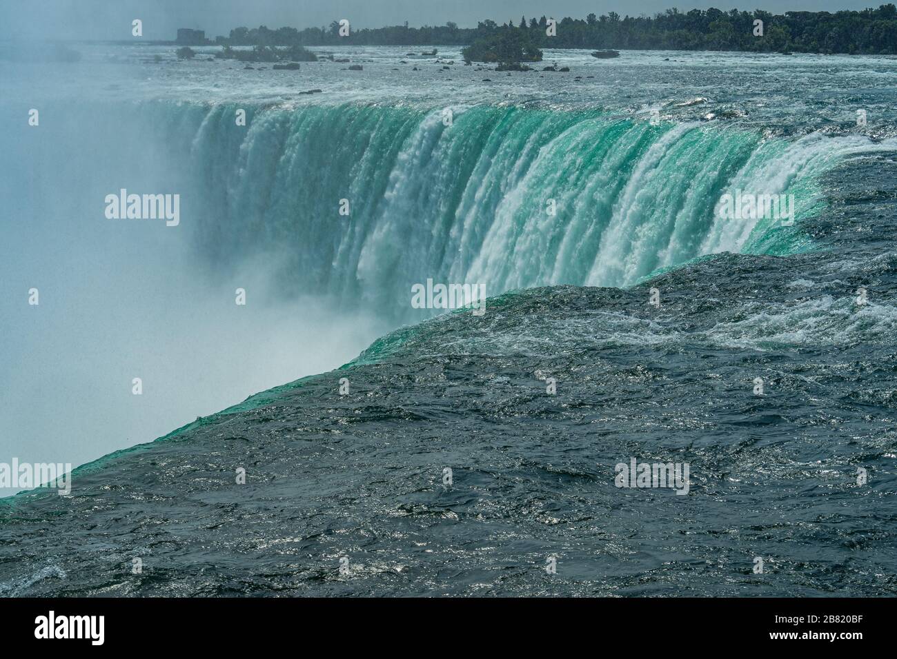 Standing at the edge of the Niagara waterfalls Stock Photo - Alamy