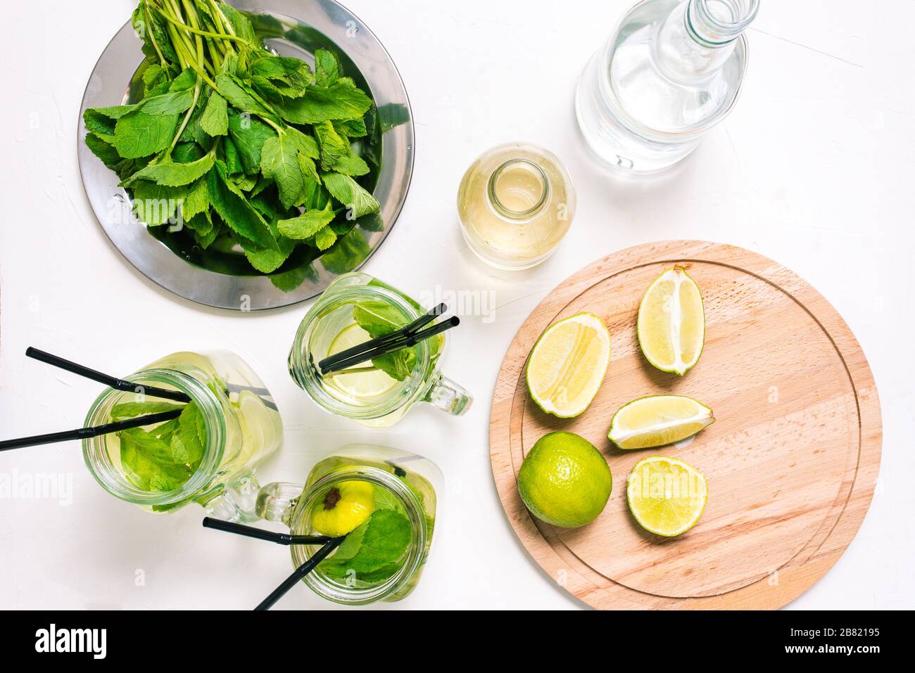 Making a summer mojito cocktail. Ingredients for an alcoholic drink on ...