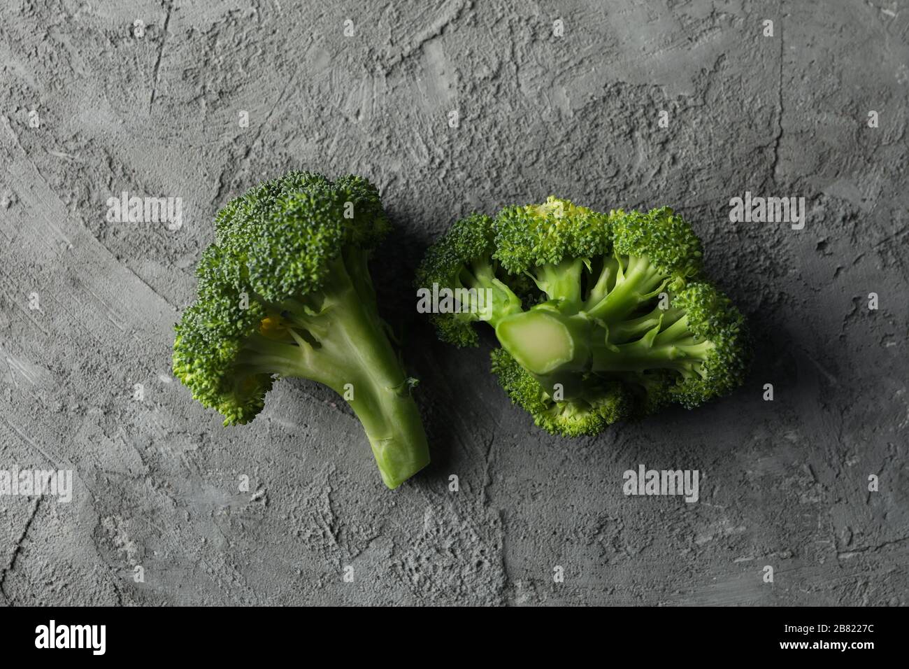 Broccoli on grey background, top view. Healthy food Stock Photo - Alamy