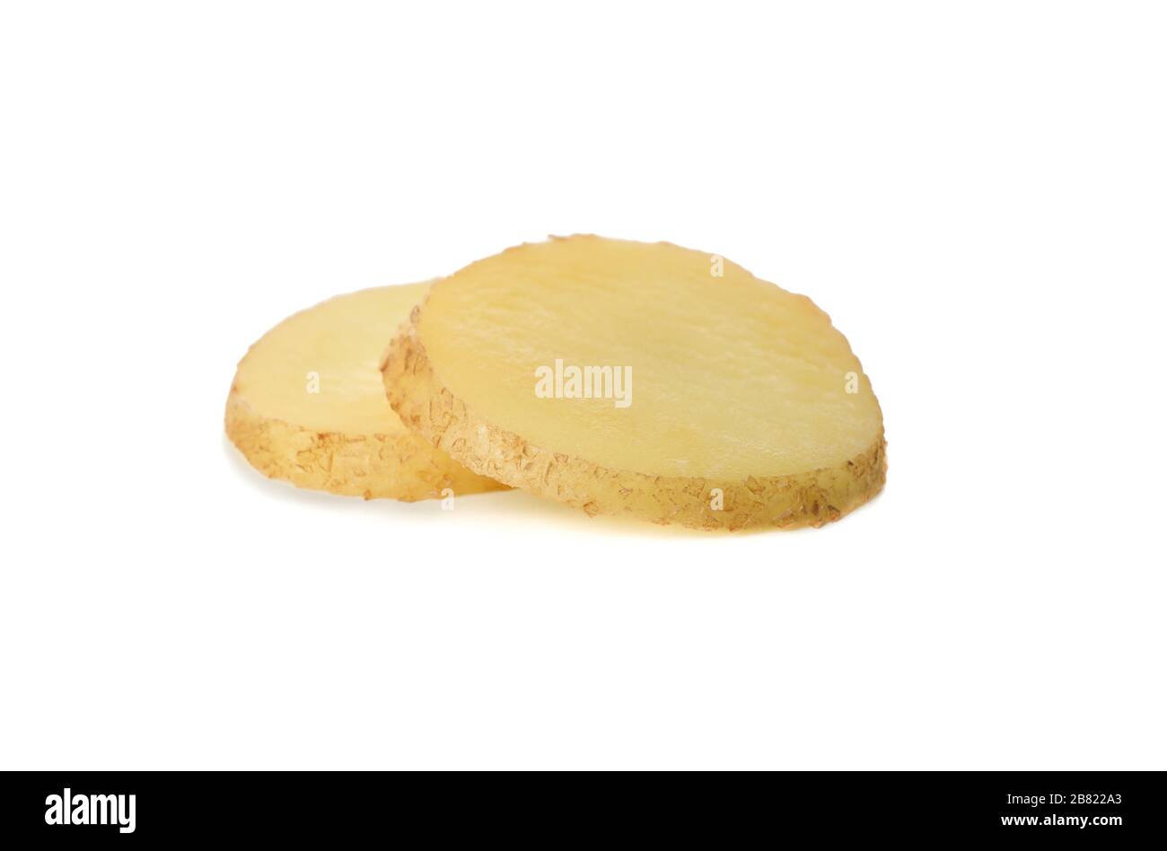 Young potato slices isolated on white background Stock Photo - Alamy