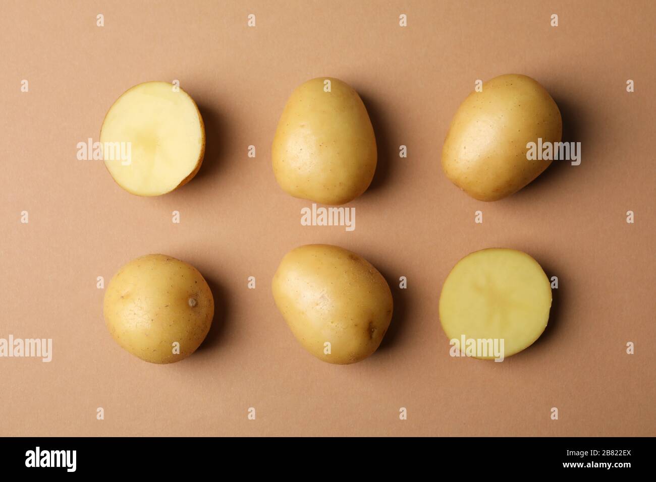 Young potato on craft background, top view Stock Photo - Alamy