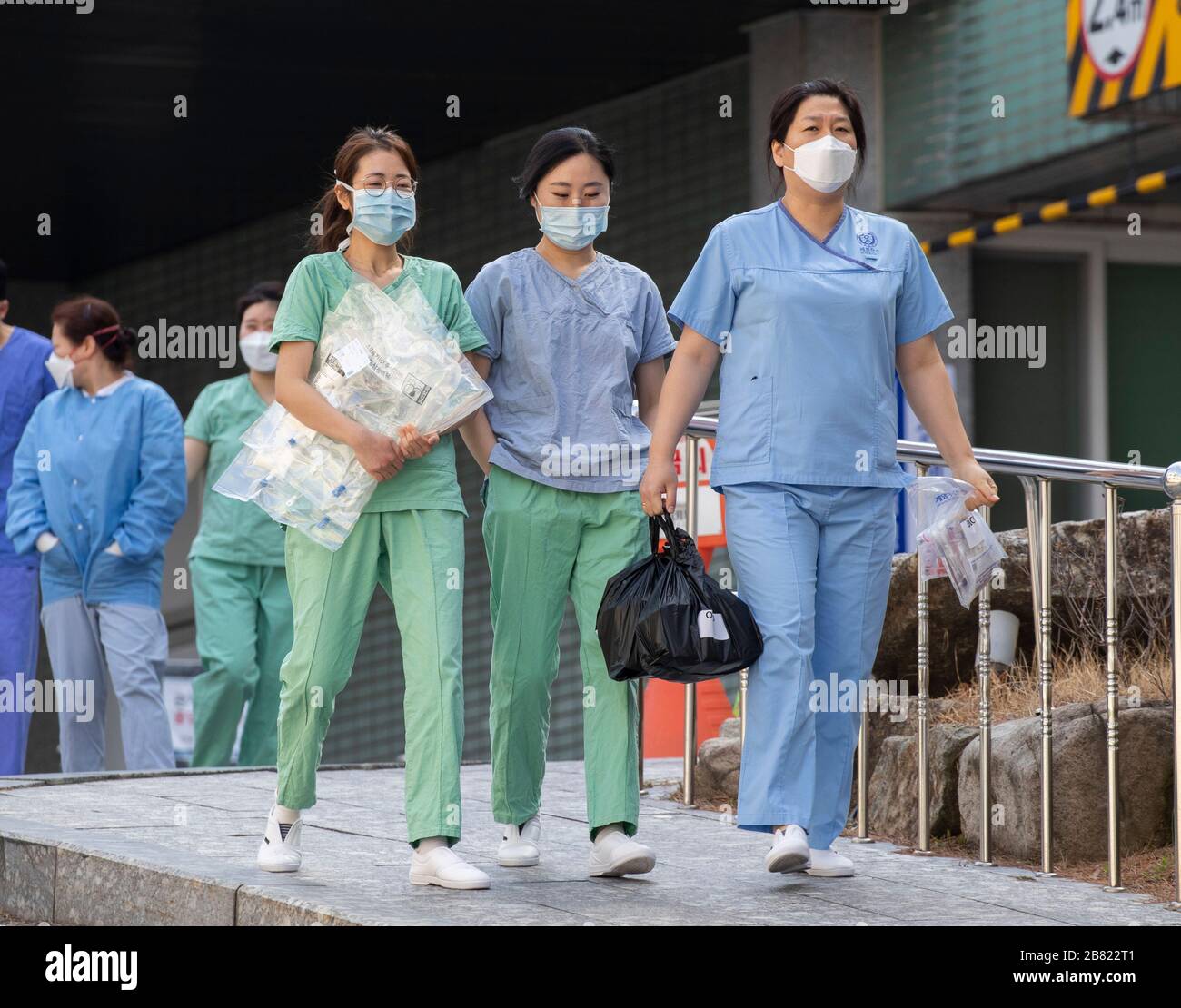 South Korean medical staff members arrive for a duty shift at Keimyung ...
