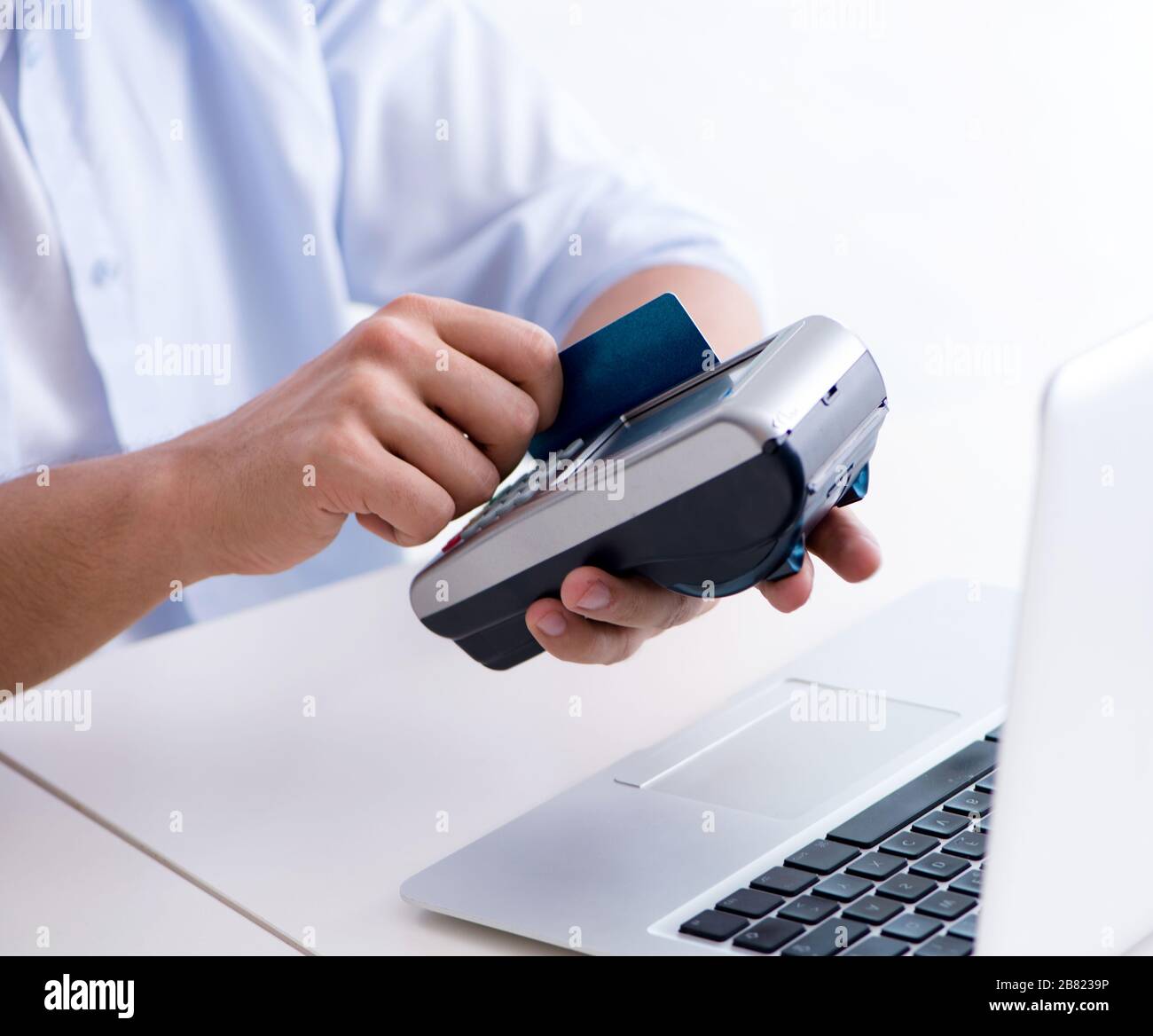 The man processing credit card transaction with pos terminal Stock ...