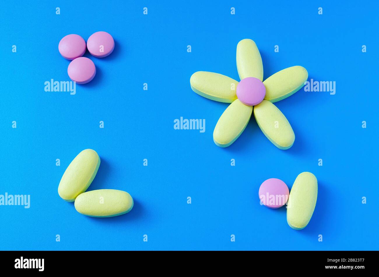 colored tablets in the shape of a flower Stock Photo - Alamy