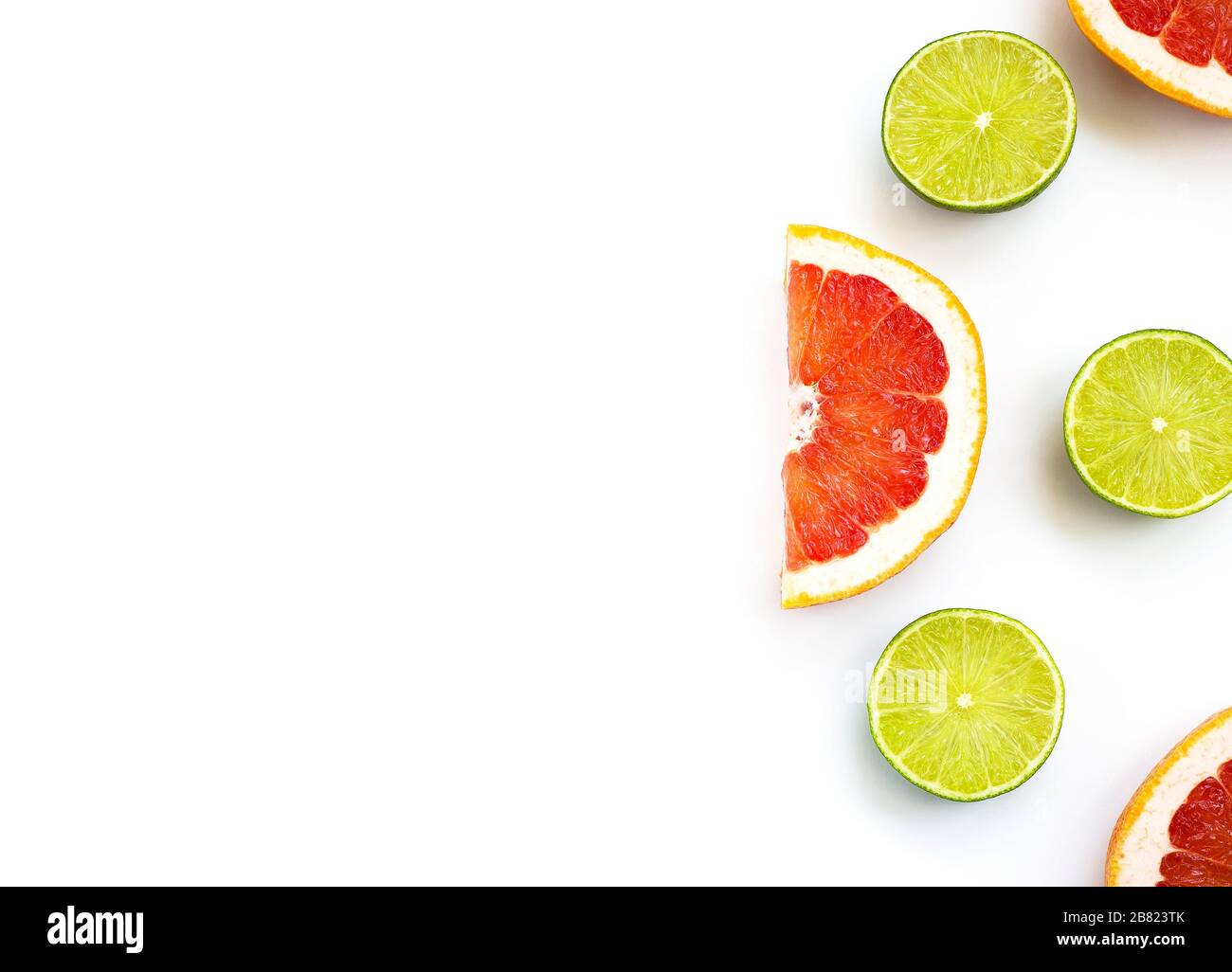 cut lime and grapefruit on a white background 7 Stock Photo - Alamy