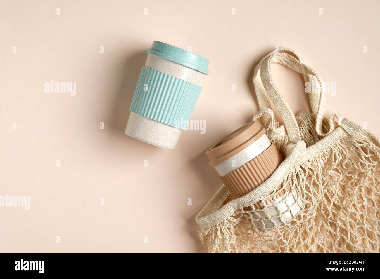 String grocery bag with eco friendly bamboo takeaway coffee cups on ...