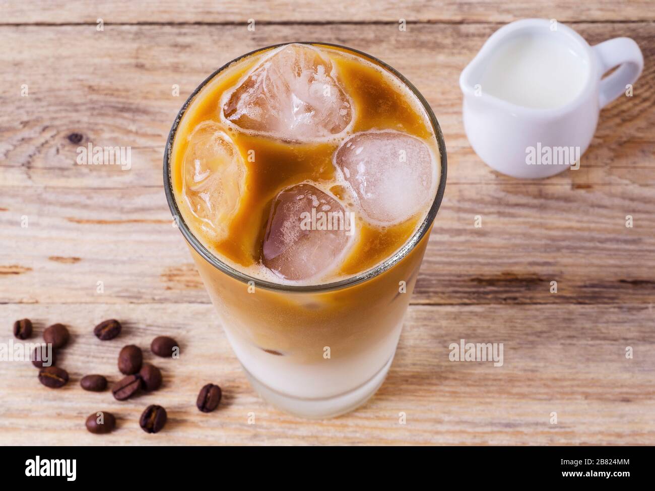 ice latte on wood background Stock Photo - Alamy