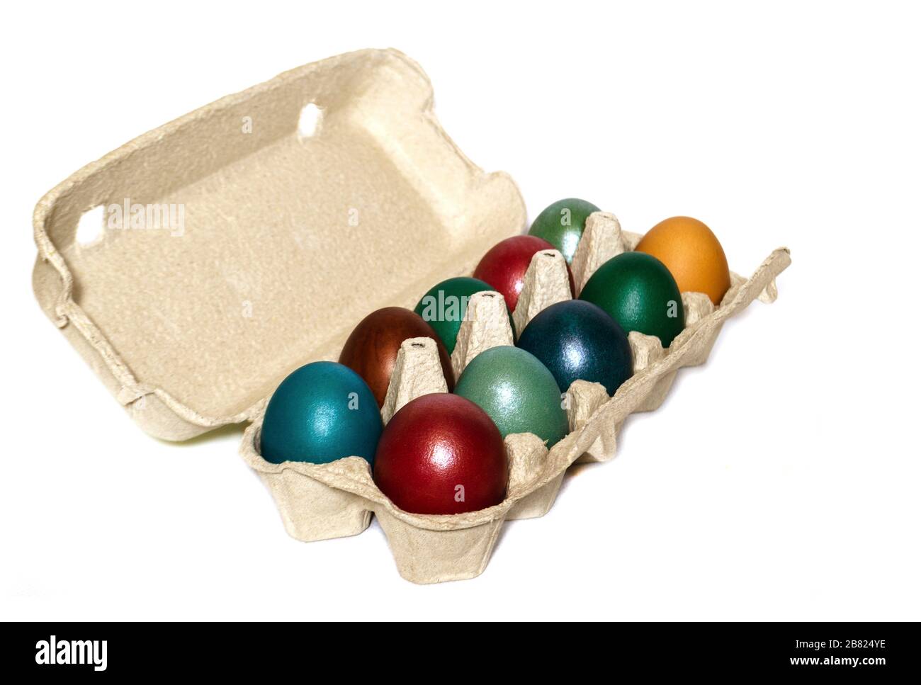 multi-colored eggs in a tray on a white background Stock Photo - Alamy