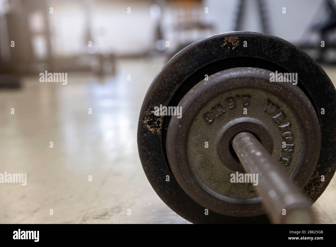 Side view of barbell on the rack in fitness gym Stock Photo - Alamy