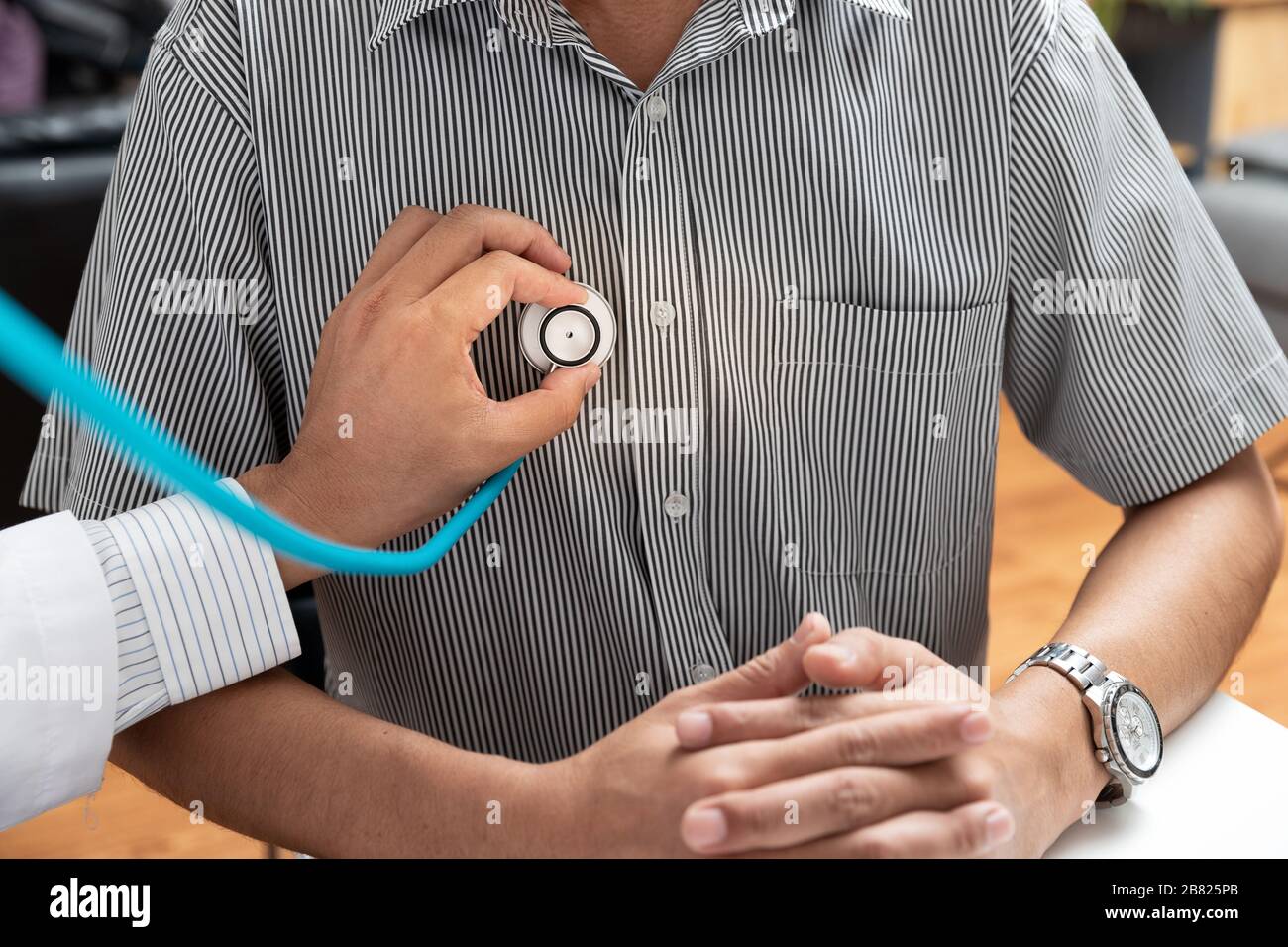 Doctor Checking Patient With Stethoscope. Doctor listening to patient ...