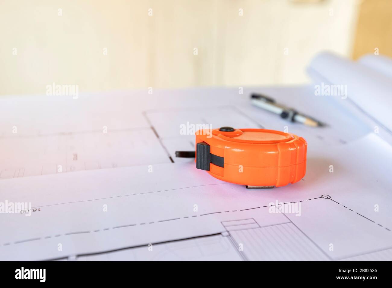 A measuring tape on house blueprint plan Stock Photo - Alamy