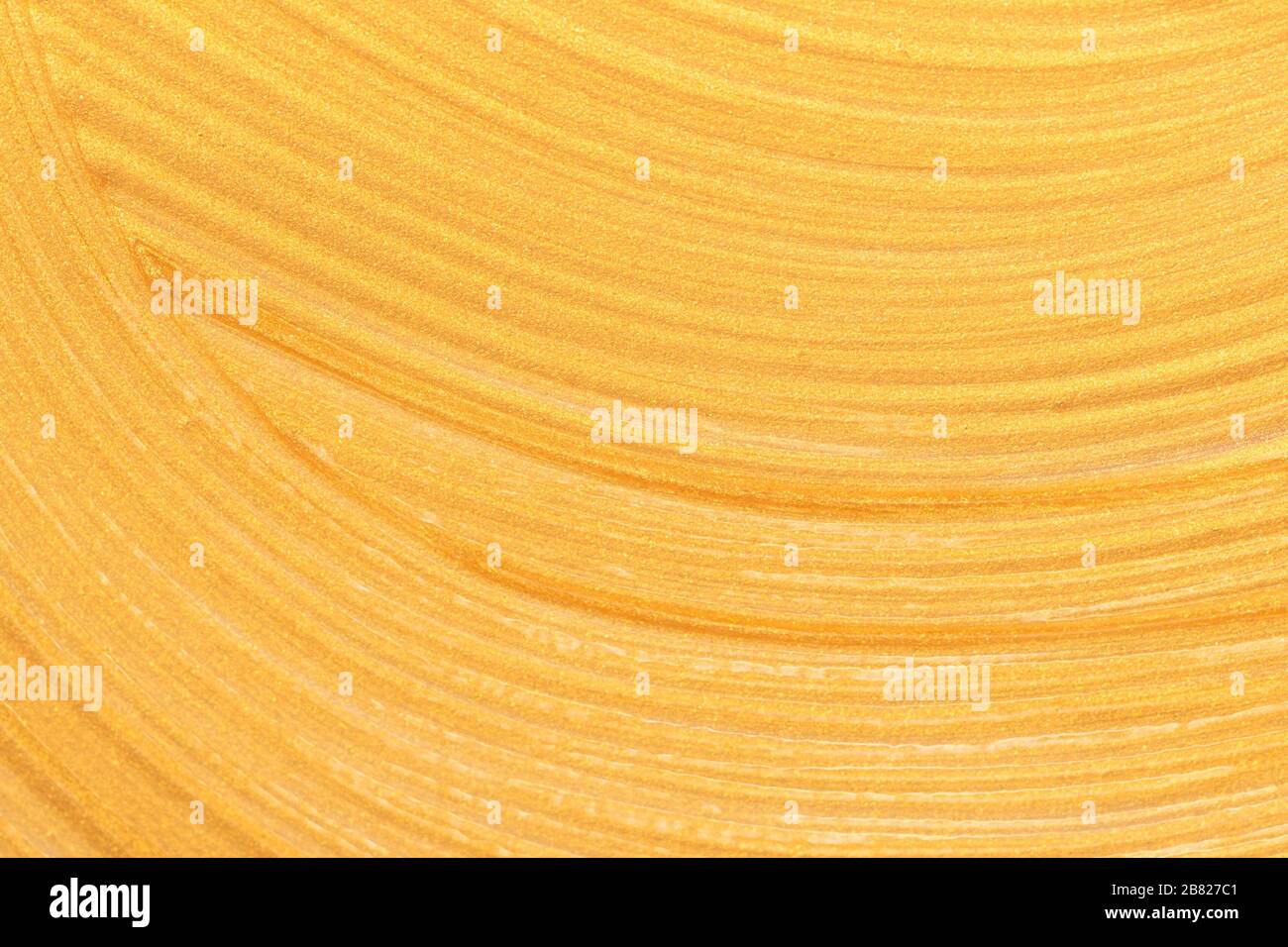 Background or texture with golden paint. Acrylic gold paint abstract ...