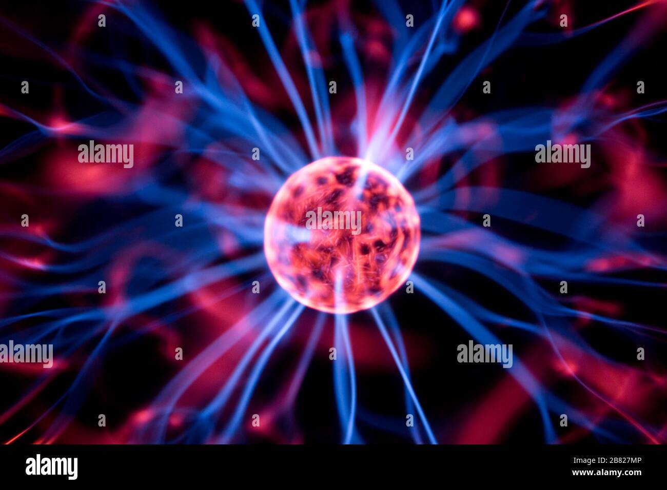 Decoration lamp in shape of plasma ball with red and blue electrodes ...
