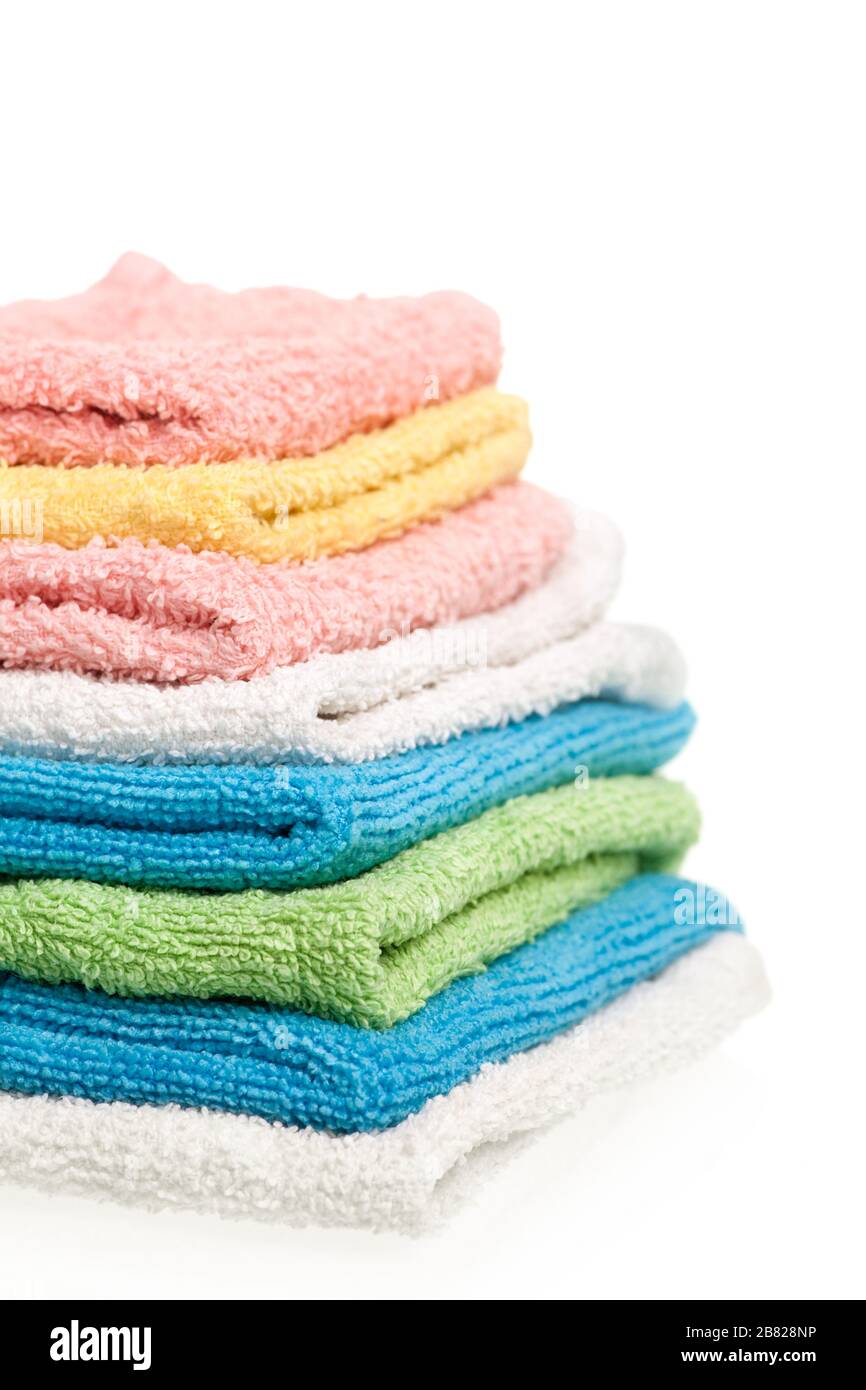 Stack of folded towels on white background Stock Photo - Alamy
