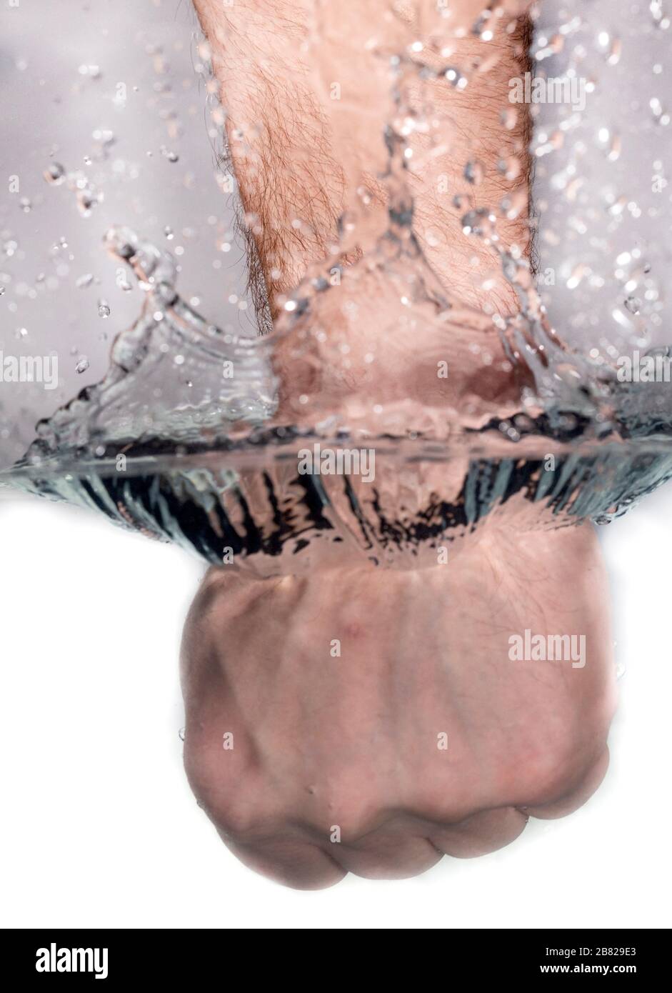 fist hitting water entrustment, underwater view Stock Photo - Alamy