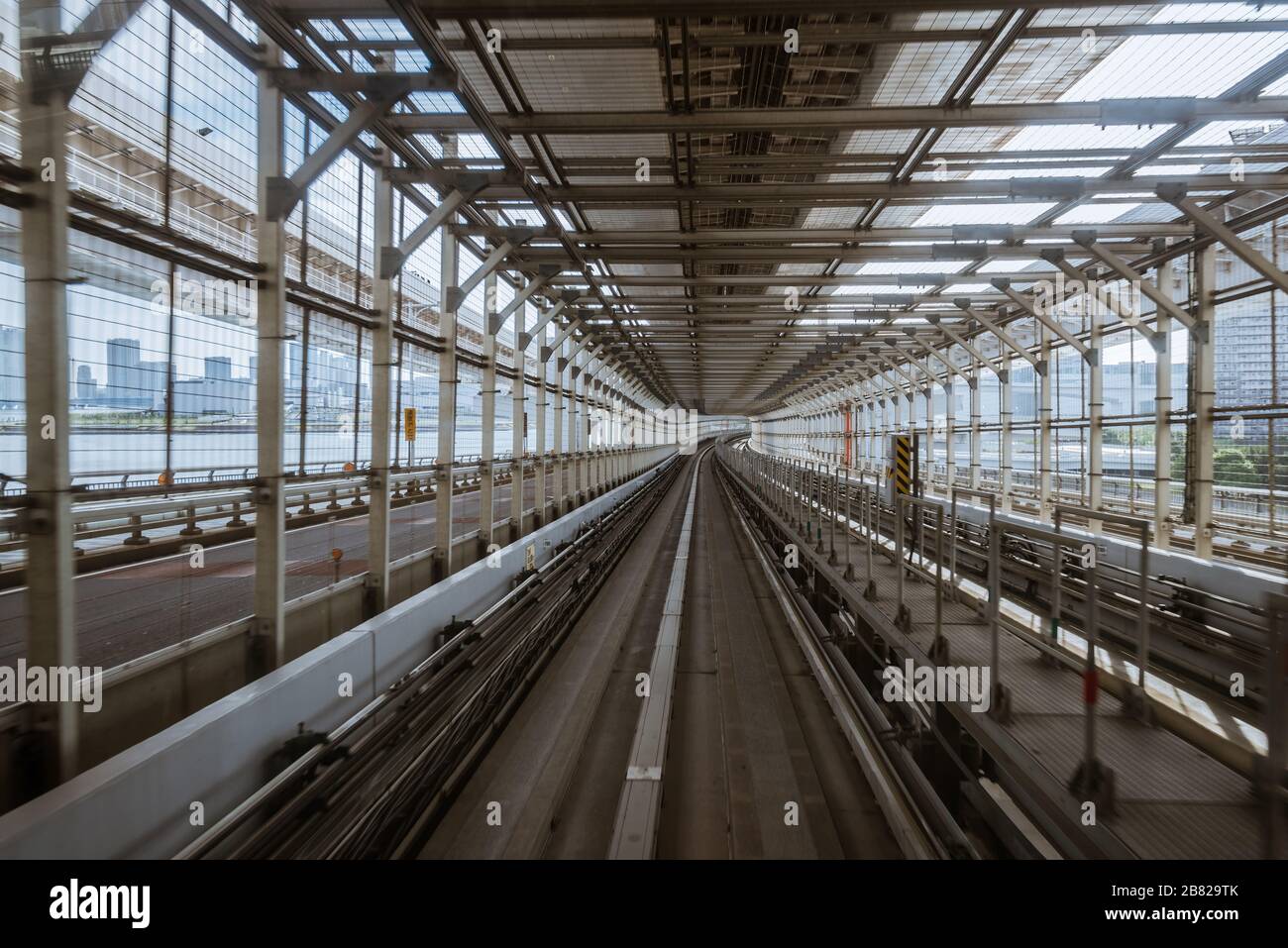 tunnel of monorail road view from front window of a moving train ...