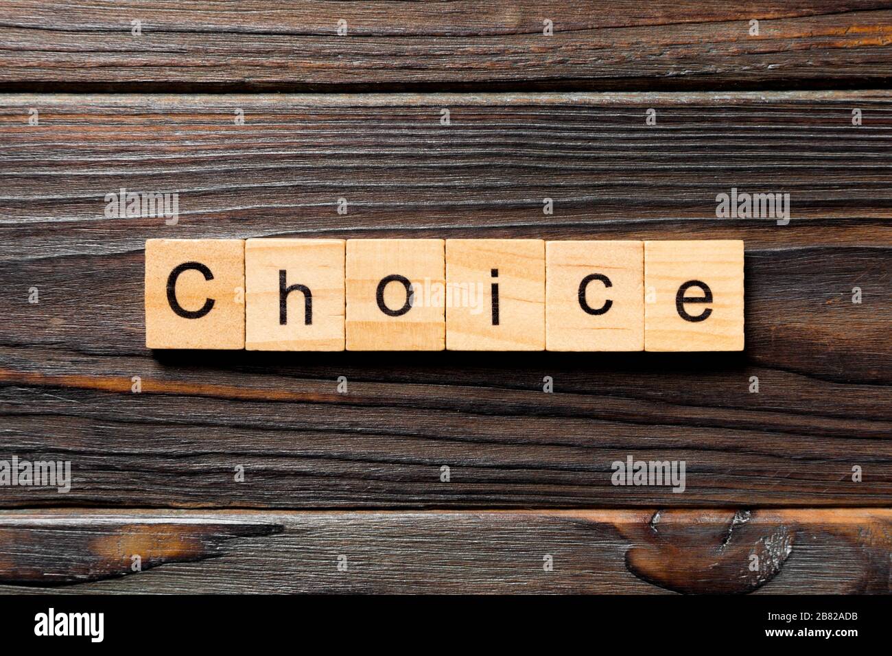 CHOICE word written on wood block. CHOICE text on wooden table for your ...