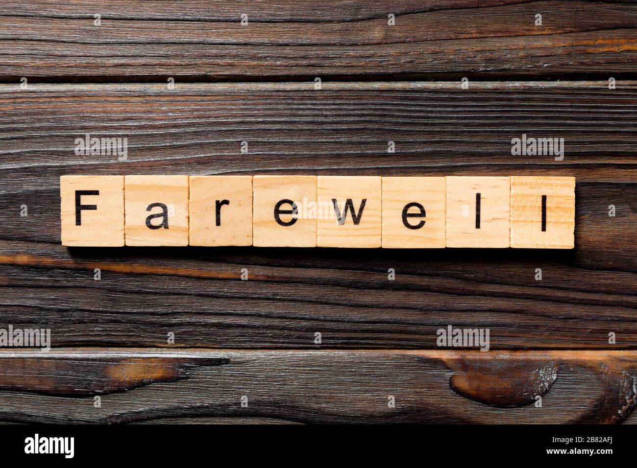 farewell word written on wood block. farewell text on table, concept ...