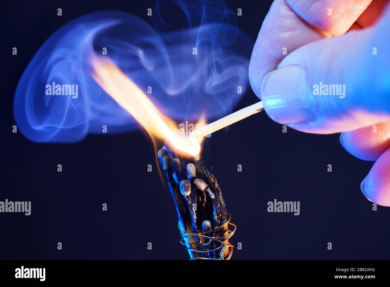 Lit matches and blown out in the studio photographed with colorful ...