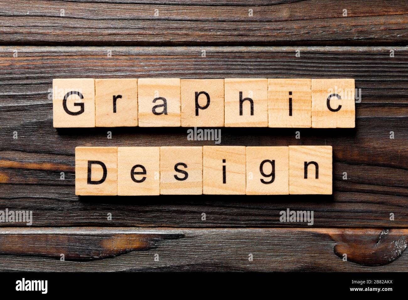 graphic design word written on wood block. graphic design text on ...