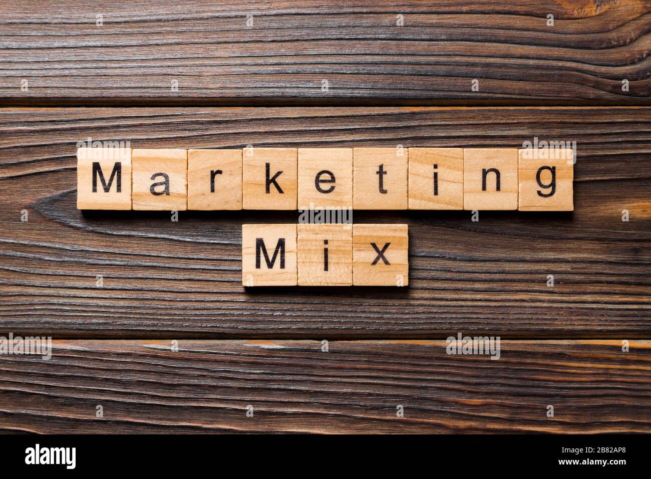 MARKETING MIX word written on wood block. MARKETING MIX text on wooden ...