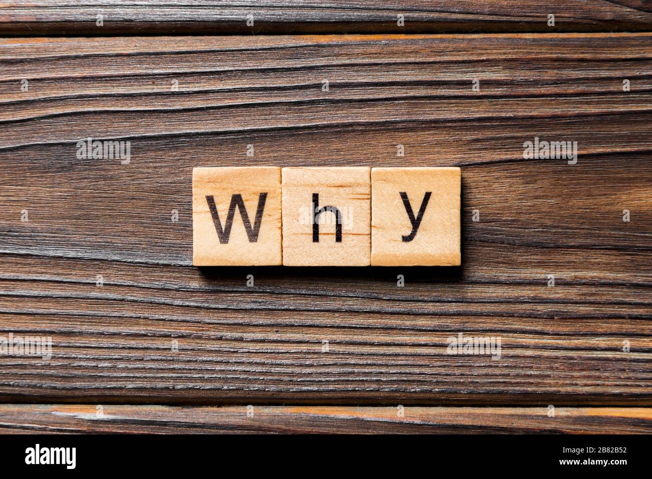 WHY word written on wood block. WHY text on wooden table for your ...