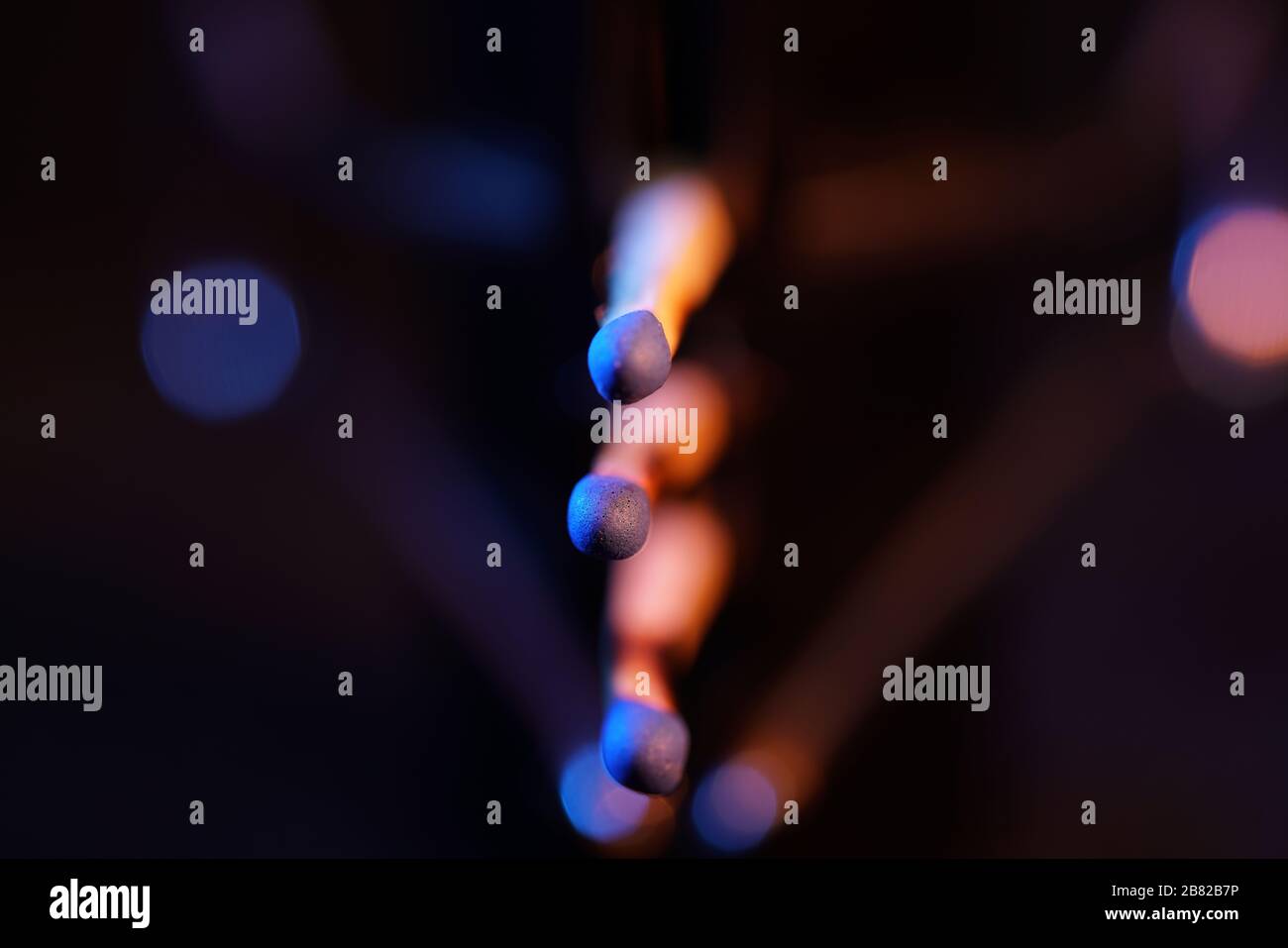 Lit matches and blown out in the studio photographed with colorful ...